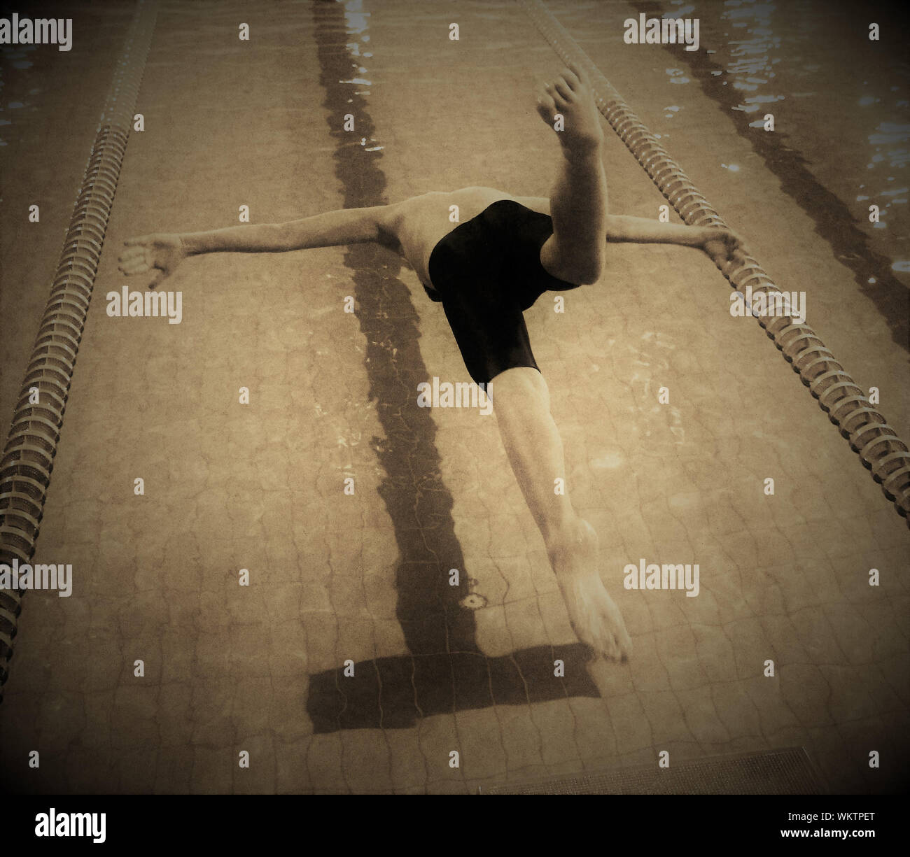 Man diving into swimming pool hi-res stock photography and images - Alamy