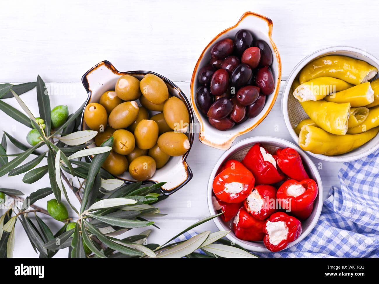Traditional appetizers, green and red olives from Greek cuisine. Fresh ...