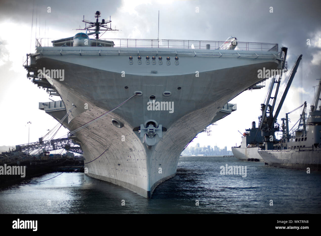 Military ship resting in a commercial dock Stock Photo - Alamy