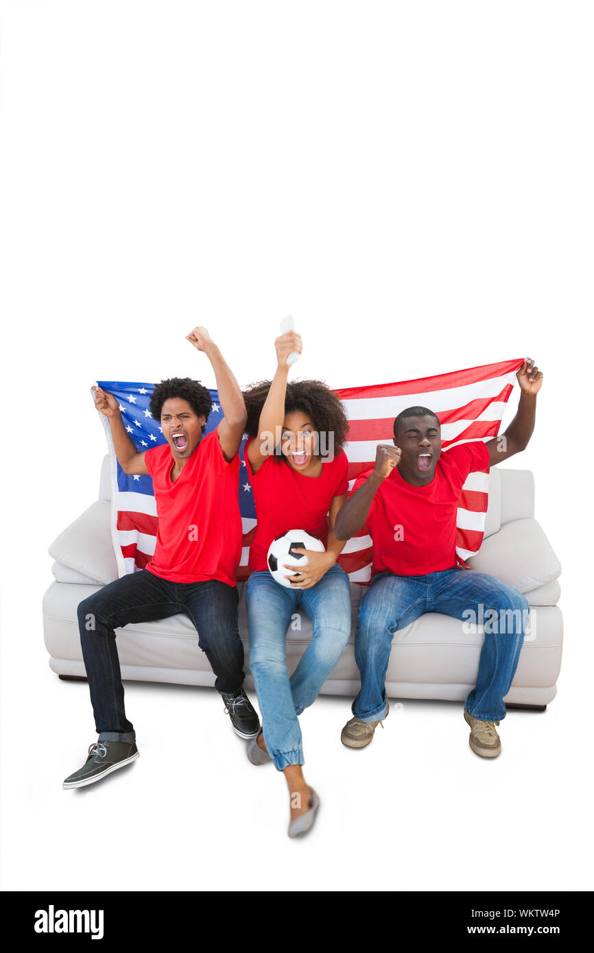 American football fans in red cheering on the sofa on white background ...