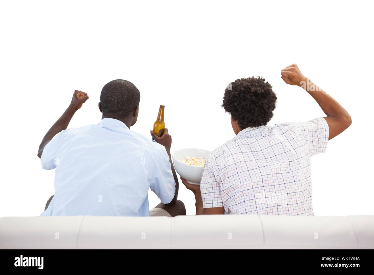 Cheering sports fans sitting on the couch with beers on white ...