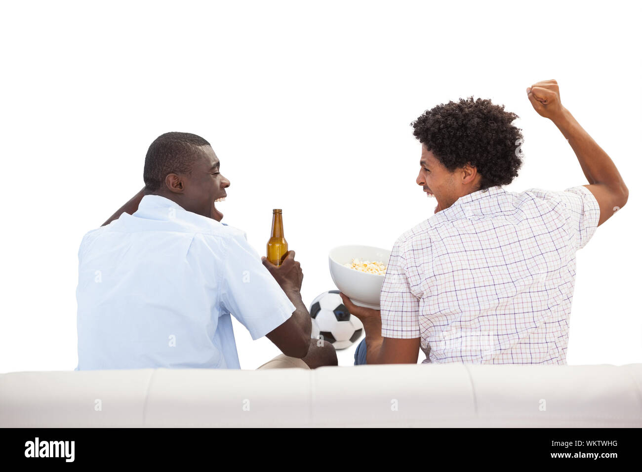 Cheering sports fans sitting on the couch with beers on white ...
