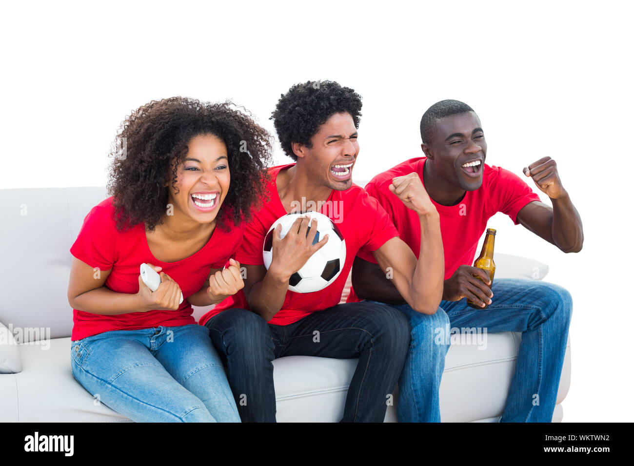 Cheering football fans in red sitting on couch on white background ...