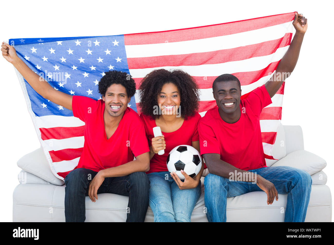 Happy football fans in red sitting on couch with usa flag on white ...