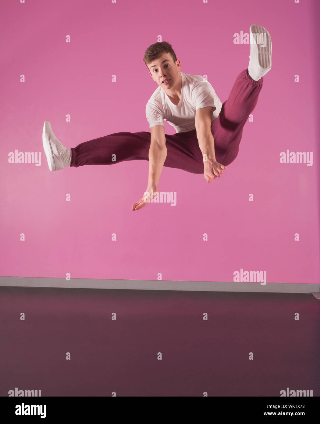 Cool break dancer mid air doing the splits in the dance studio Stock ...