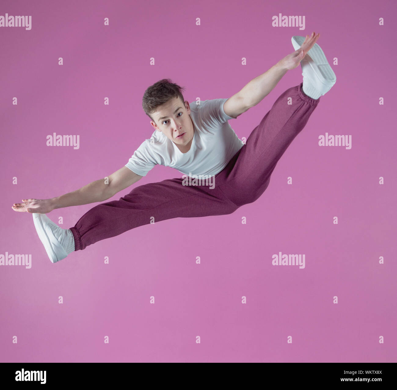 Cool break dancer mid air doing the splits in the dance studio Stock ...
