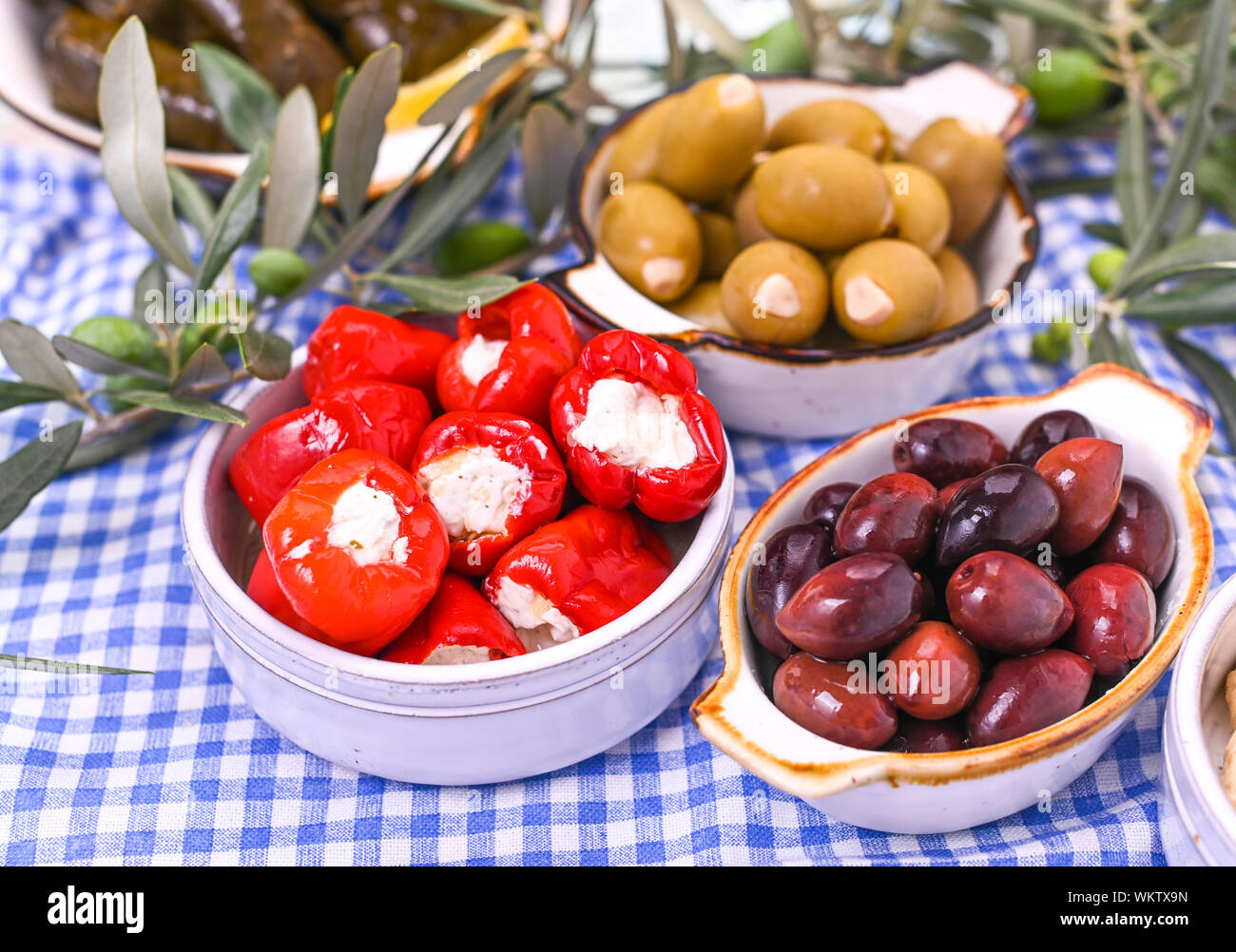 Traditional appetizers, green and red olives from Greek cuisine. Fresh ...