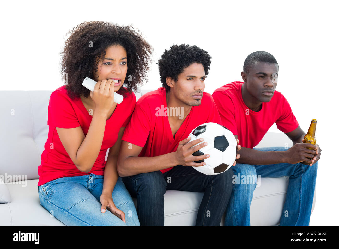 Nervous football fans in red sitting on couch on white background Stock ...