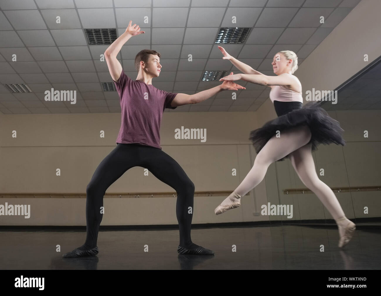 Ballet partners dancing gracefully together in the ballet studio Stock ...