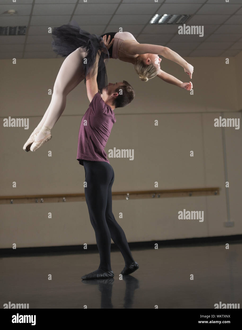 Ballet partners dancing gracefully together in the ballet studio Stock ...