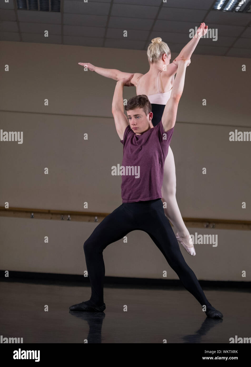 Ballet partners dancing gracefully together in the ballet studio Stock ...
