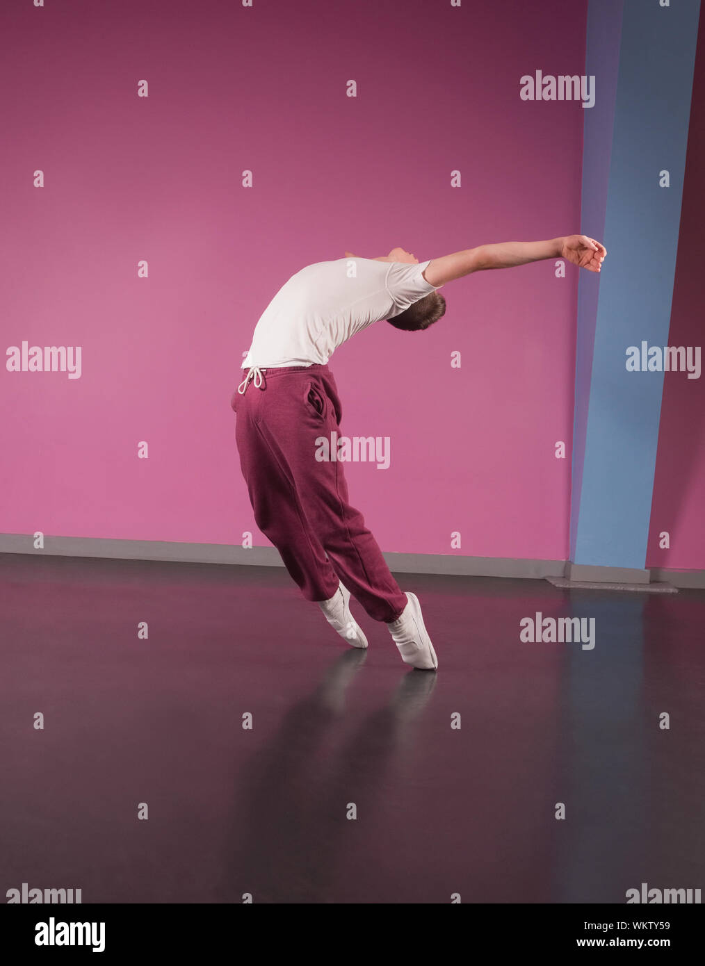 Cool break dancer stretching backwards in the dance studio Stock Photo ...