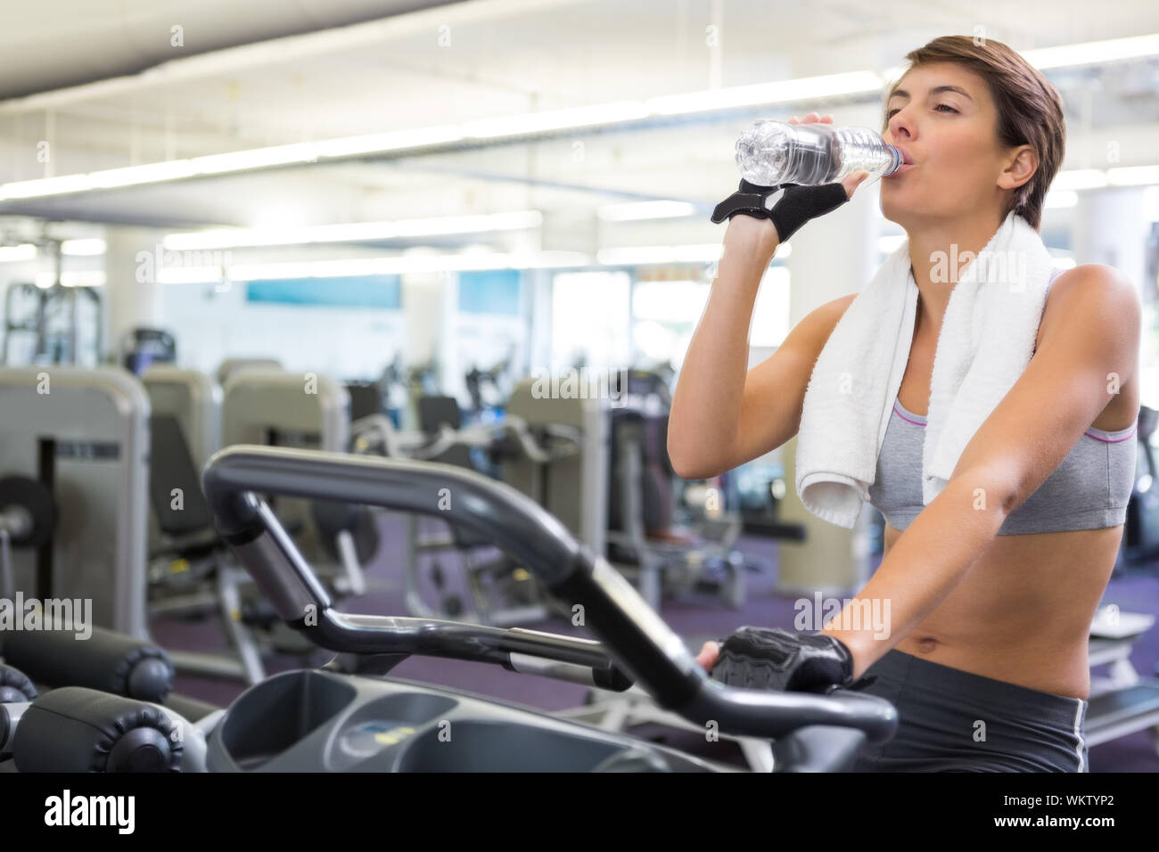 Woman on exercise bike drink hi-res stock photography and images - Alamy