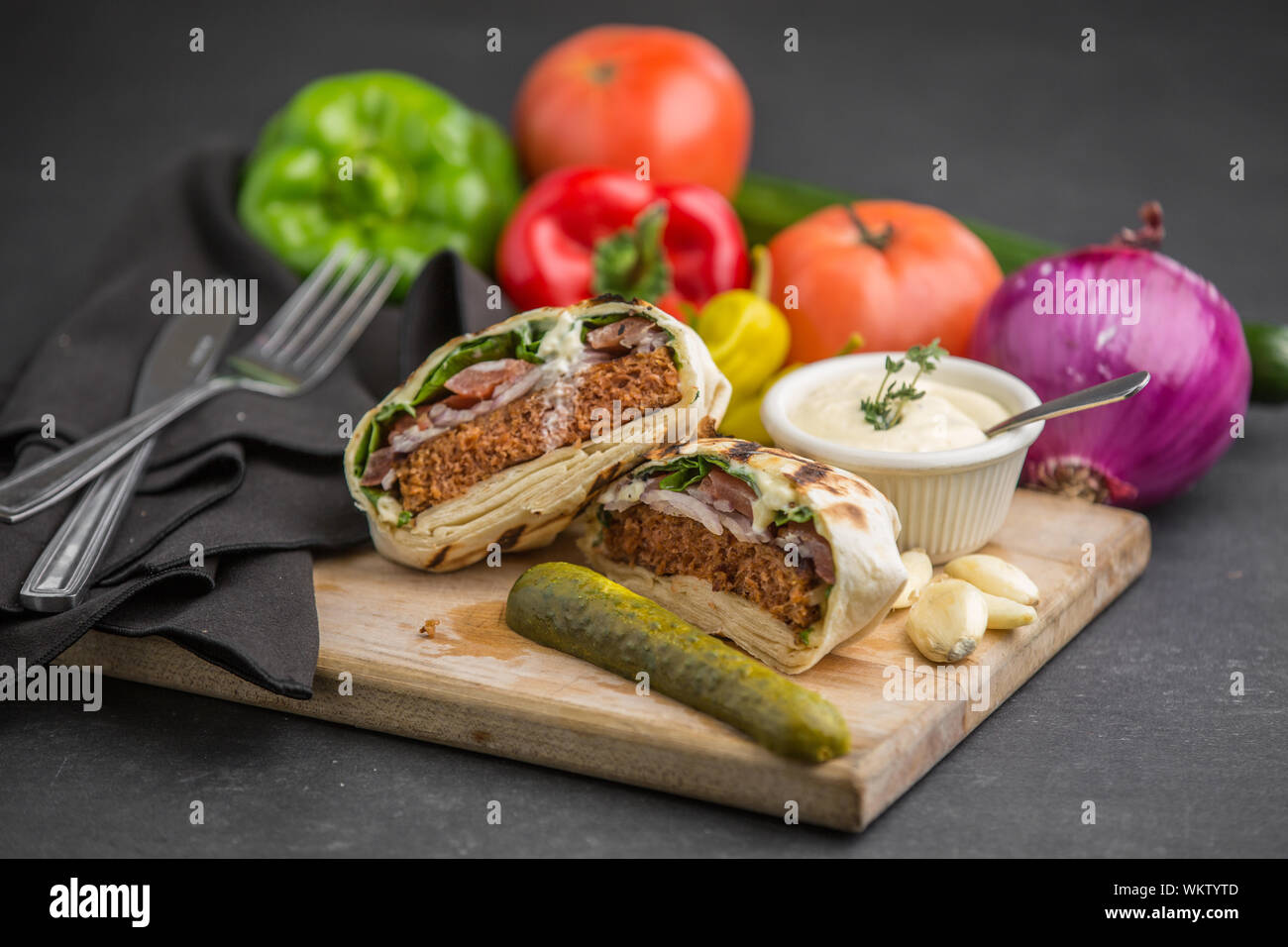 no meat burger on board. Fresh vegetables as background Stock Photo - Alamy