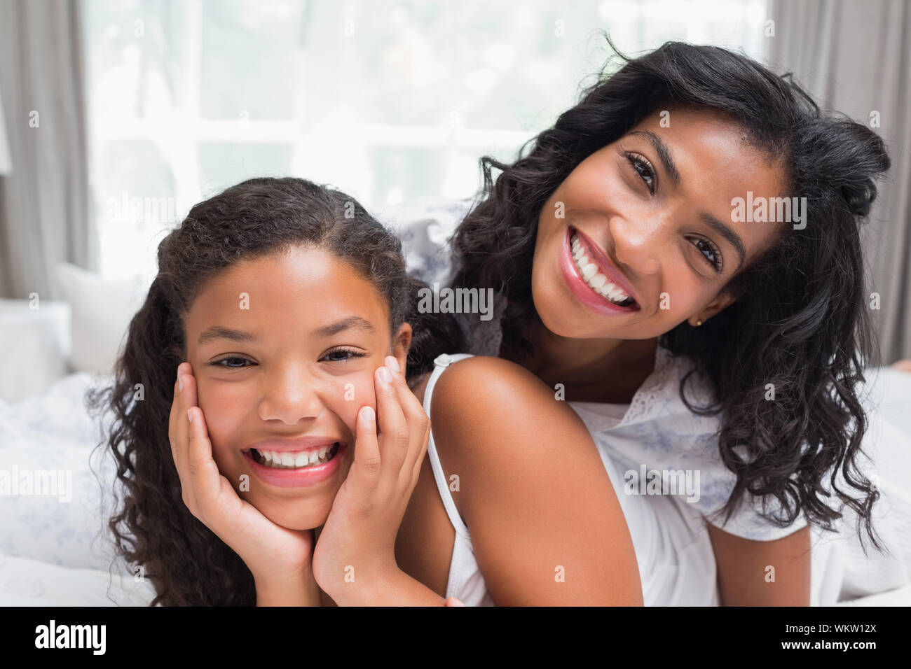 Mother daughter posing on bed hi-res stock photography and images - Alamy