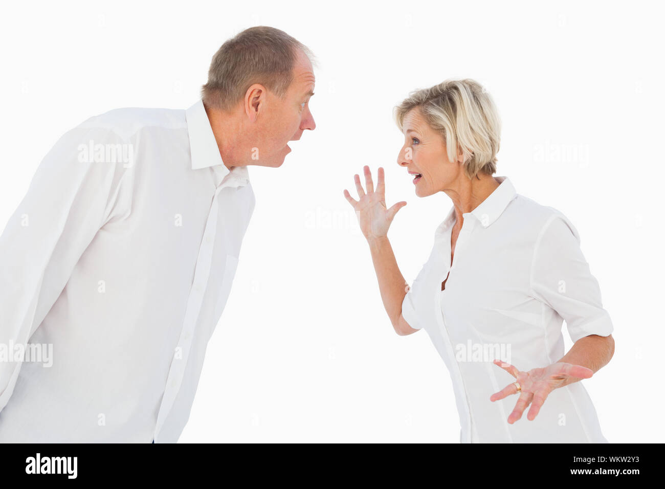 Angry older couple arguing with each other on white background Stock ...
