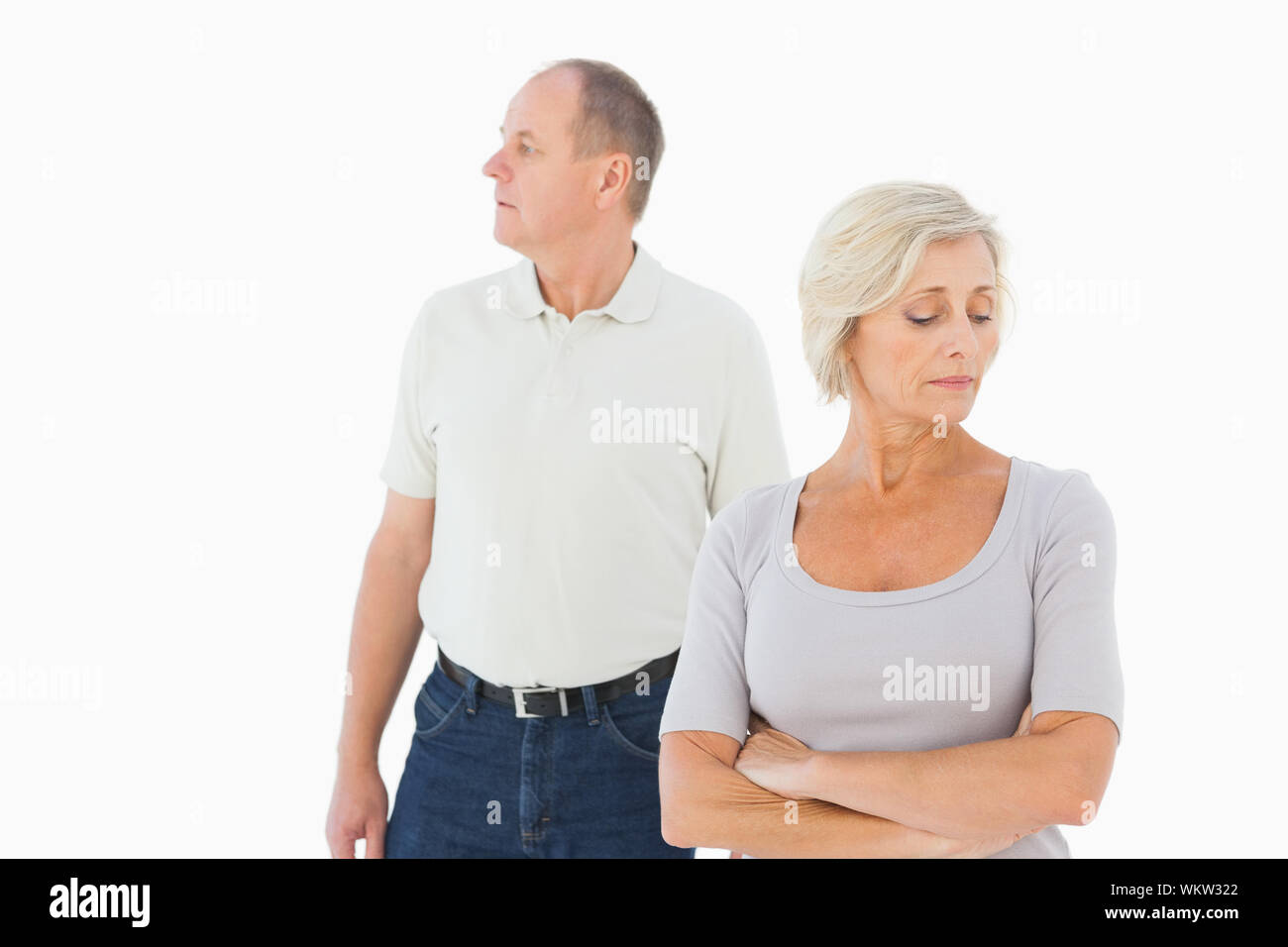 Older couple having an argument on white background Stock Photo - Alamy