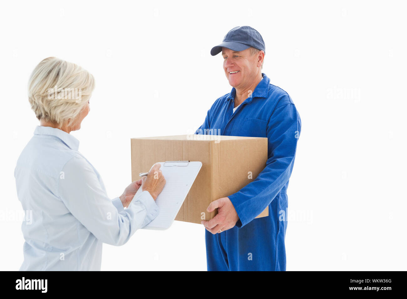 Happy delivery man with customer on white background Stock Photo - Alamy