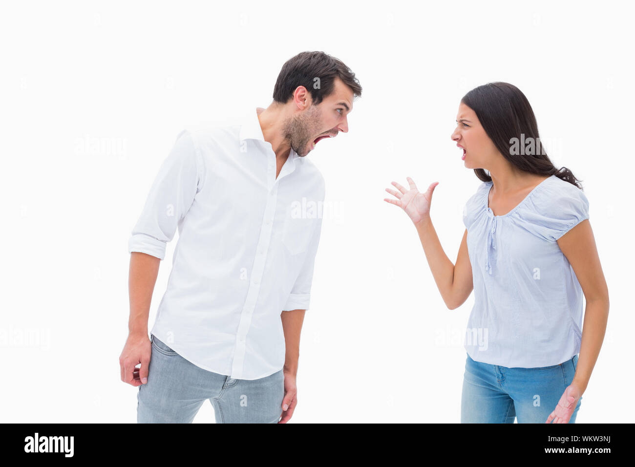 Angry couple shouting at each other on white background Stock Photo - Alamy