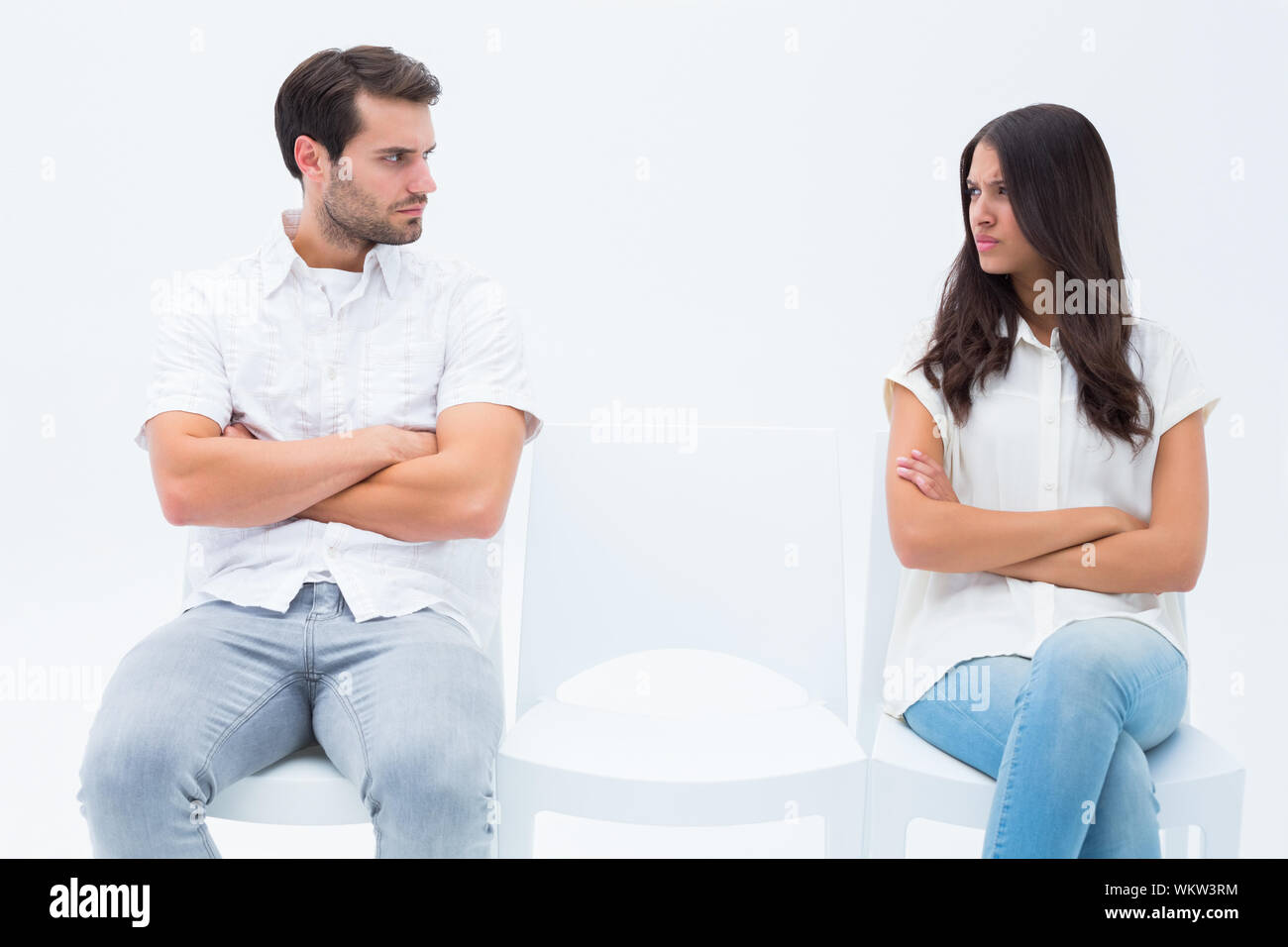 Angry couple not talking after argument on white background Stock Photo ...