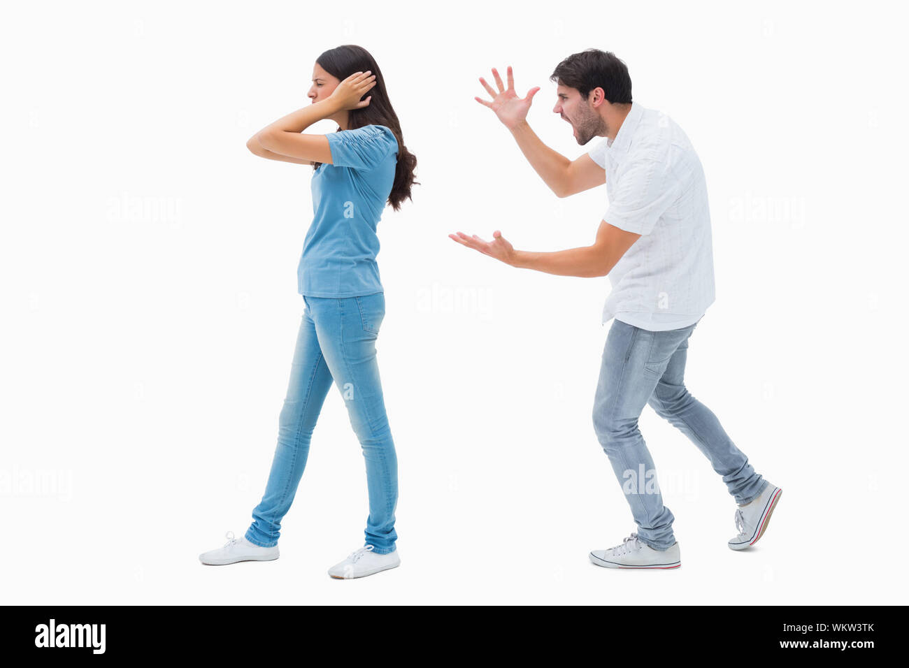 Angry boyfriend shouting at girlfriend on white background Stock Photo ...