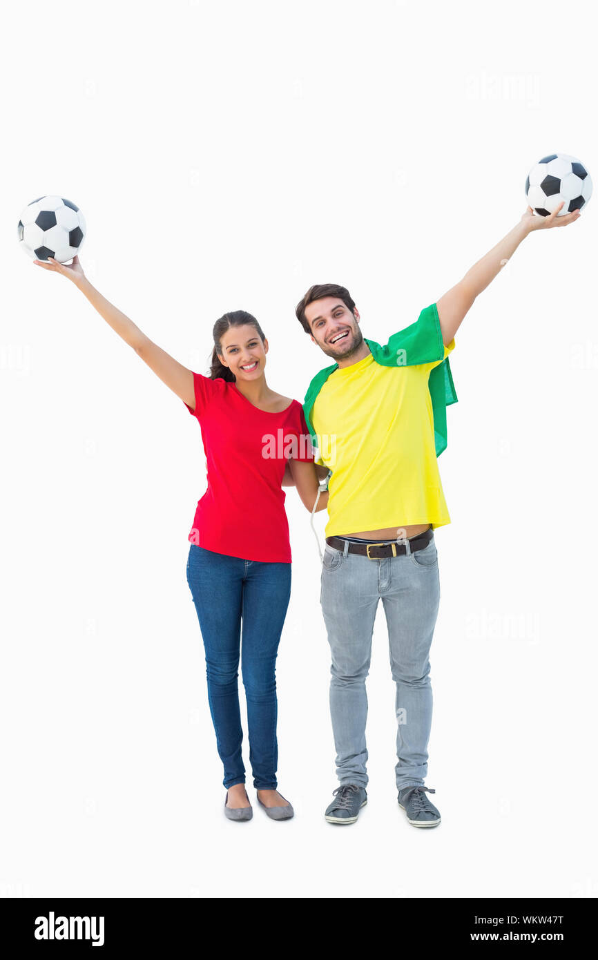 Football fan couple cheering and smiling at camera on white background ...
