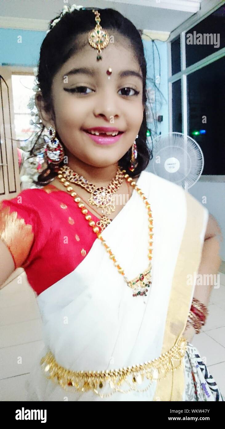 Traditional re white sari hi-res stock photography and images - Alamy