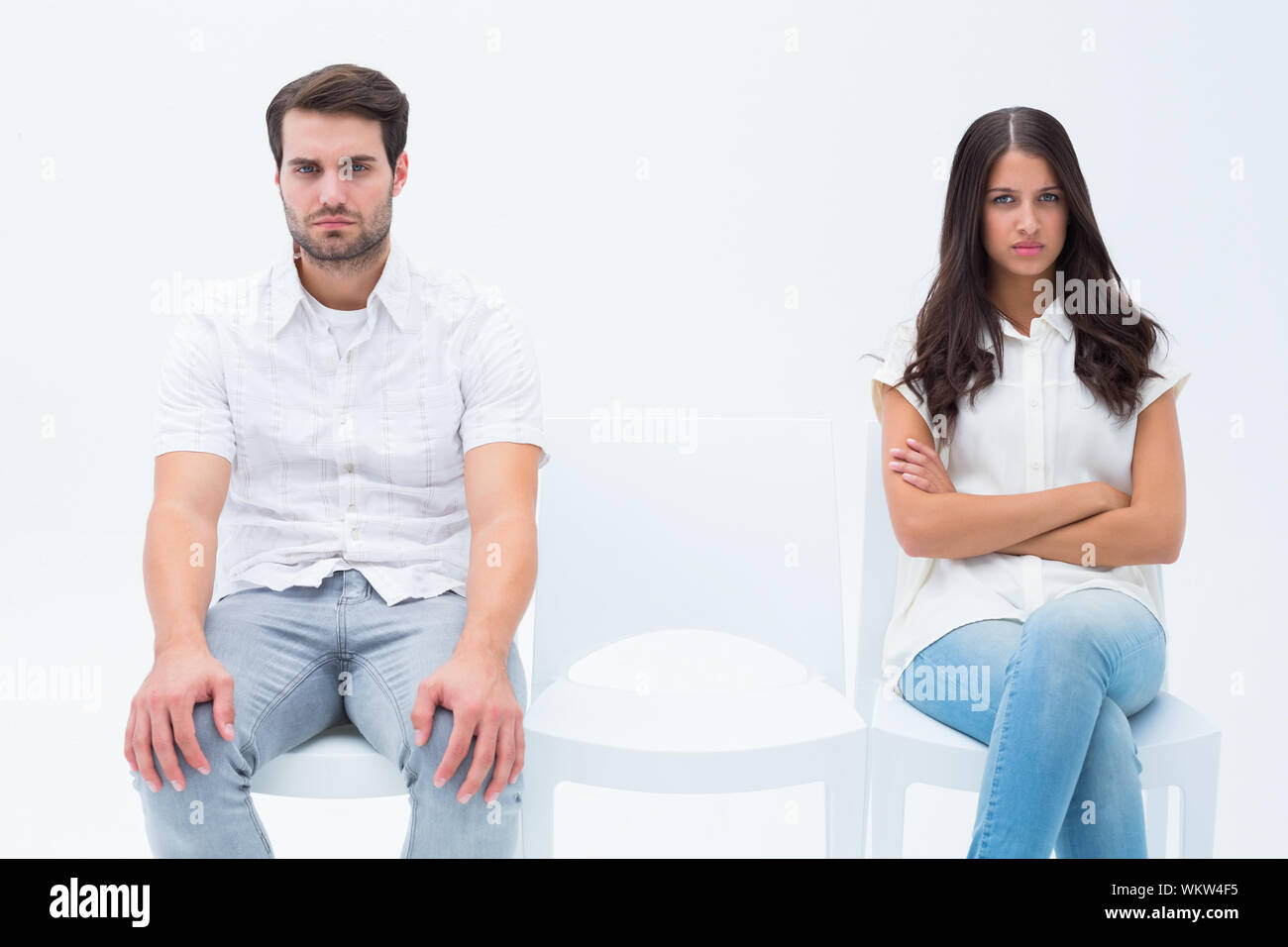 Angry couple not talking after argument on white background Stock Photo ...