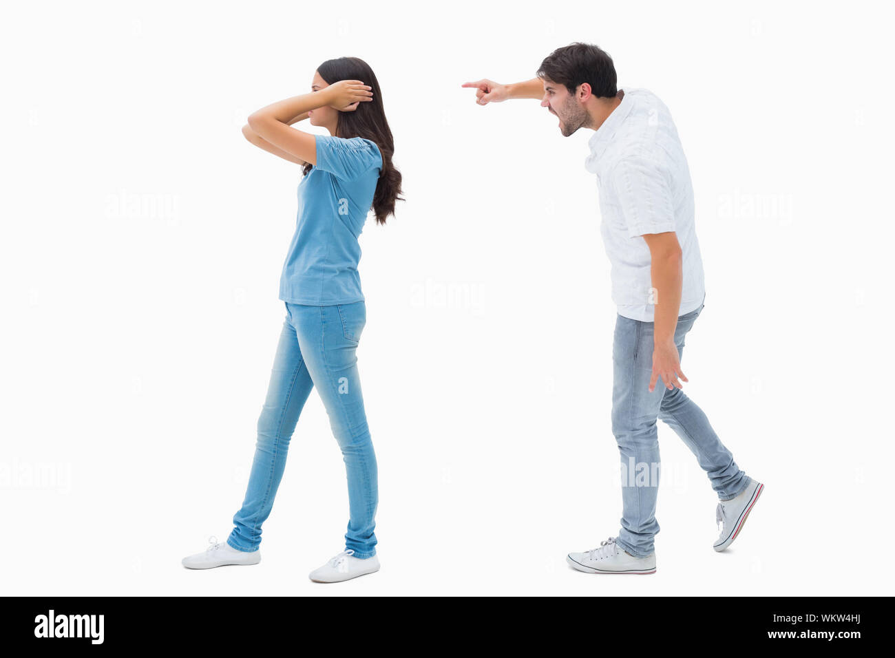 Angry boyfriend shouting at girlfriend on white background Stock Photo ...