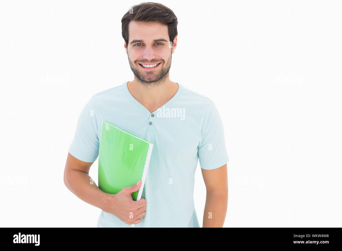 Handsome student smiling at camera on white background Stock Photo - Alamy