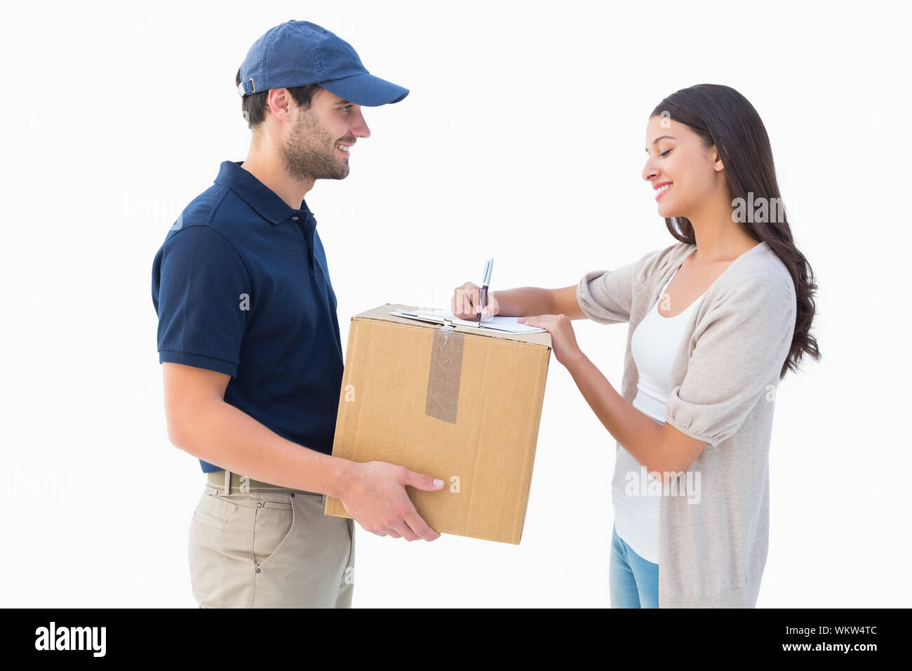 Happy delivery man with customer on white background Stock Photo - Alamy