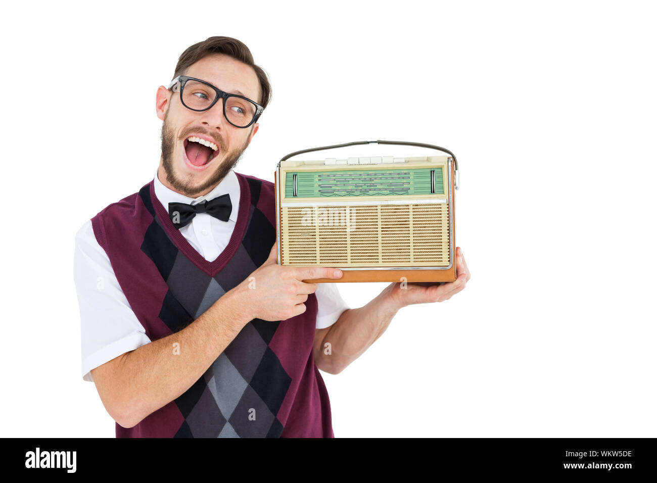 Geeky hipster holding a retro radio on white background Stock Photo - Alamy