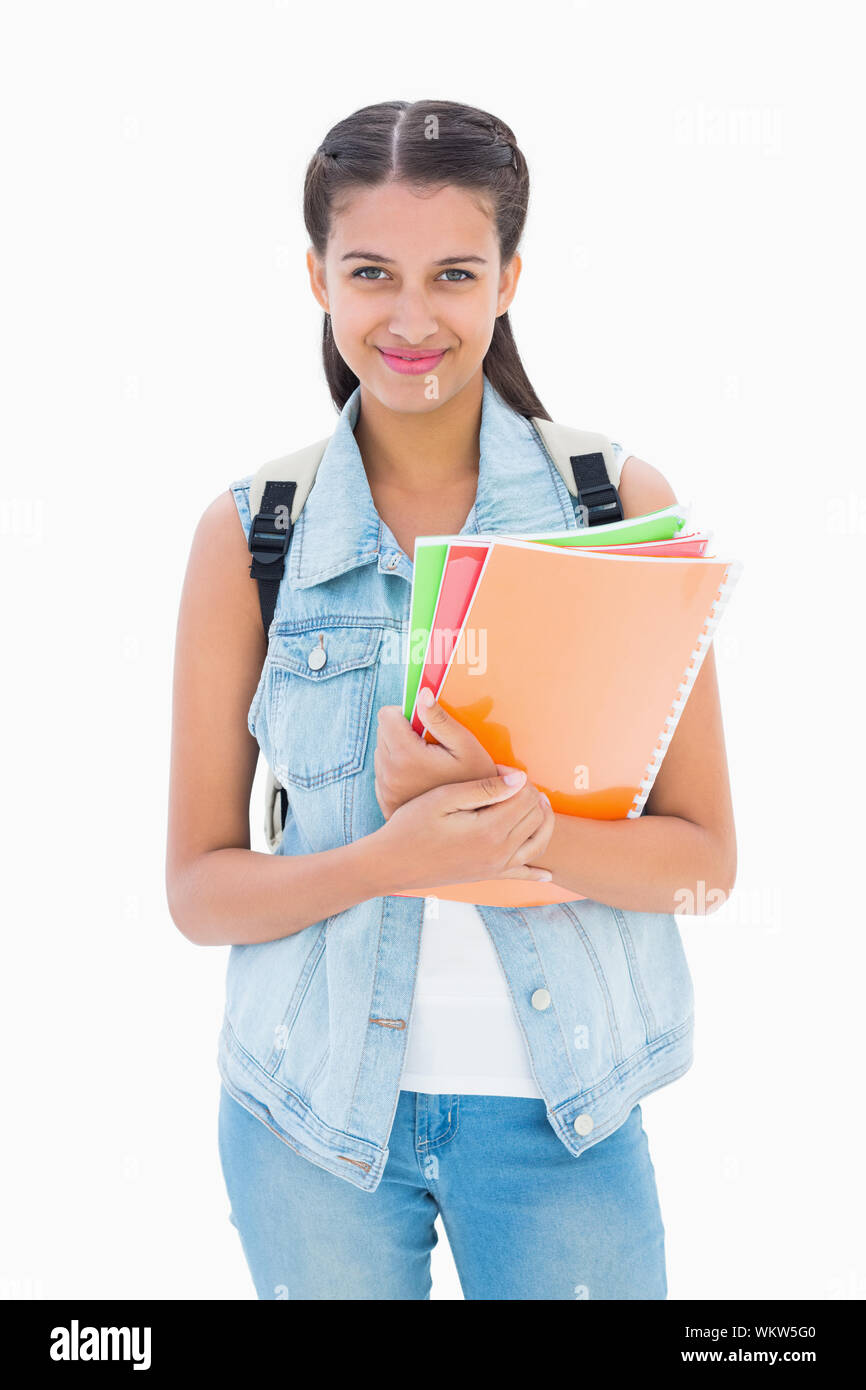 Pretty student smiling at camera on white background Stock Photo - Alamy