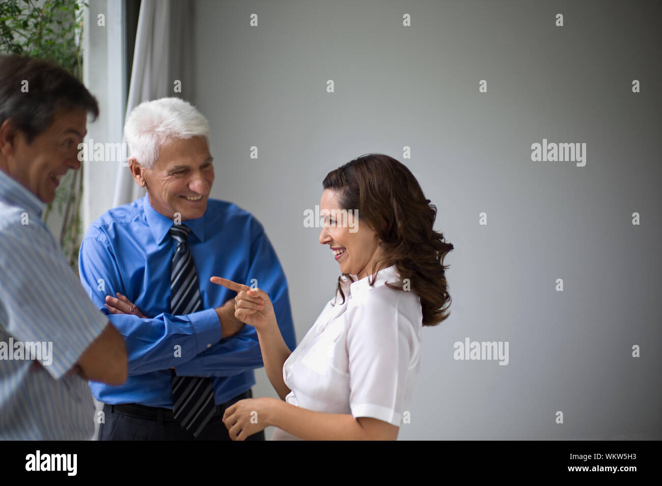 Joyful men colleagues talking laughing hi-res stock photography and ...