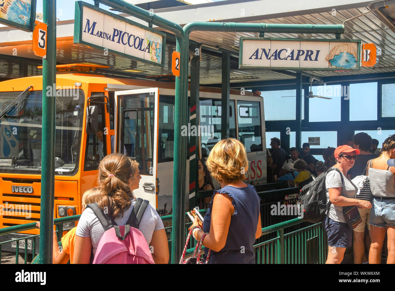 ISLE OF CAPRI, ITALY - AUGUST 2019: People at the bus station in the ...