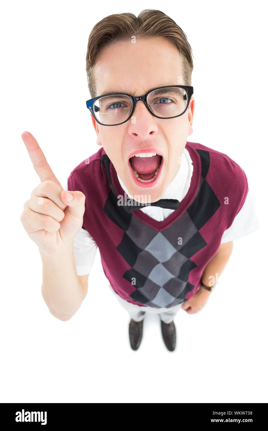Angry geeky hipster pointing at camera on white background Stock Photo ...