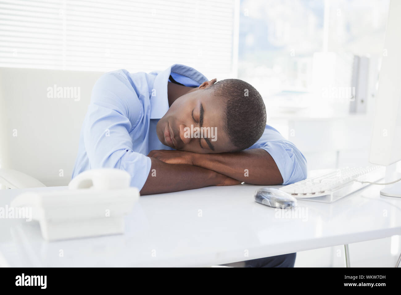 Black businessman sleeping desk hi-res stock photography and images - Alamy