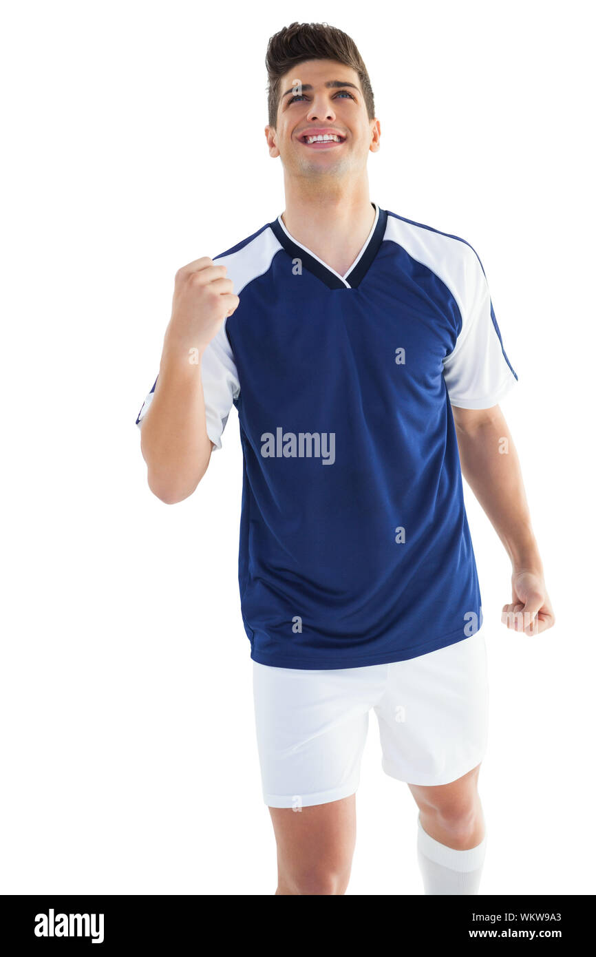 Football player in blue celebrating on white background Stock Photo - Alamy