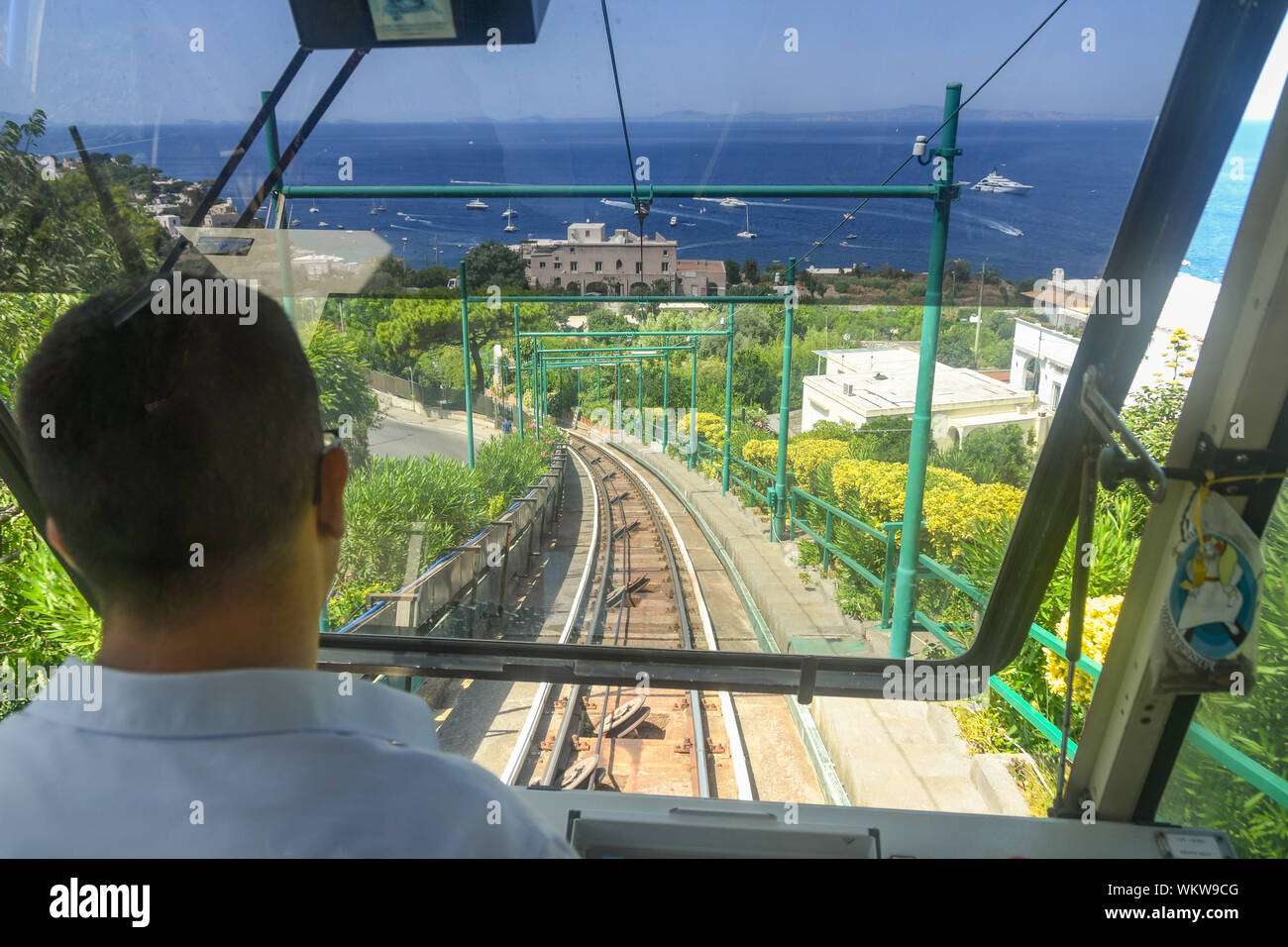 ISLE OF CAPRI, ITALY - AUGUST 2019: Driver in the cab of a train on the ...