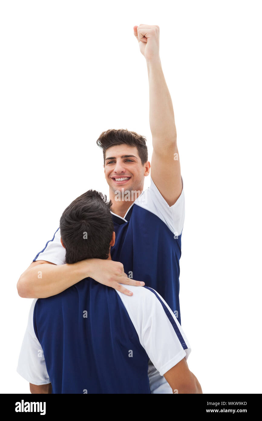 Football players celebrating a win on white background Stock Photo - Alamy