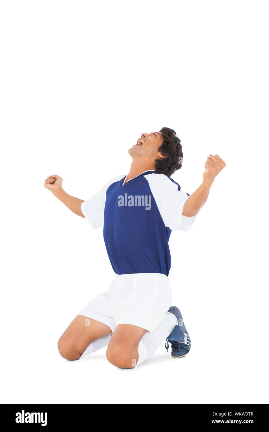 Football player in blue celebrating on white background Stock Photo - Alamy
