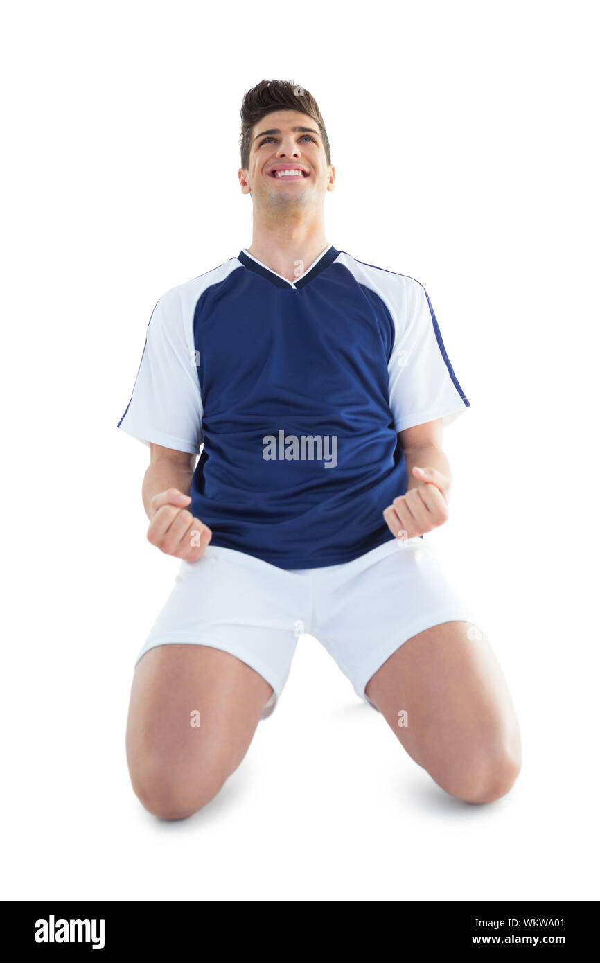 Football player in blue celebrating on white background Stock Photo - Alamy