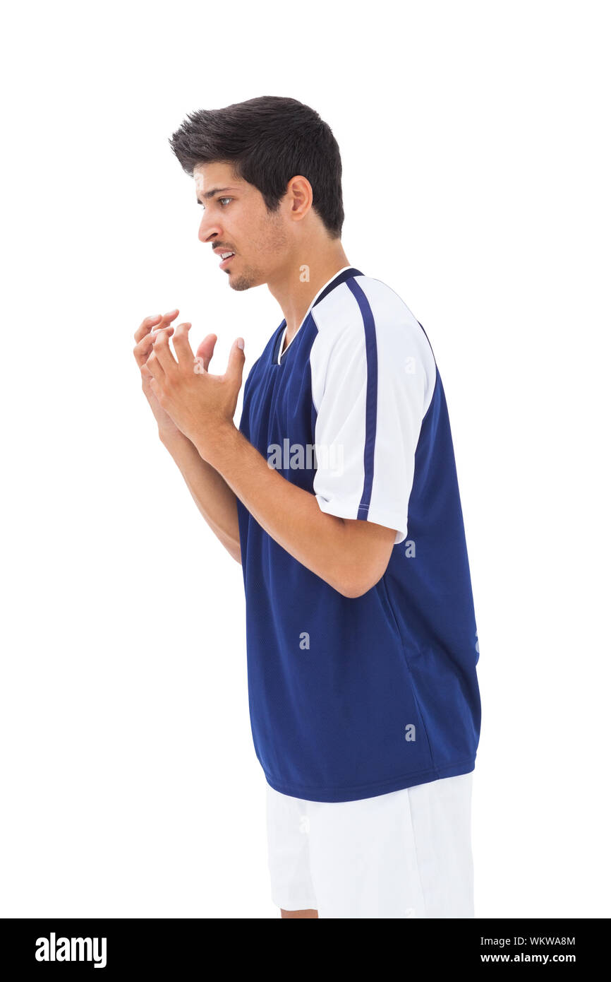 Football player feeling distraught on white background Stock Photo - Alamy