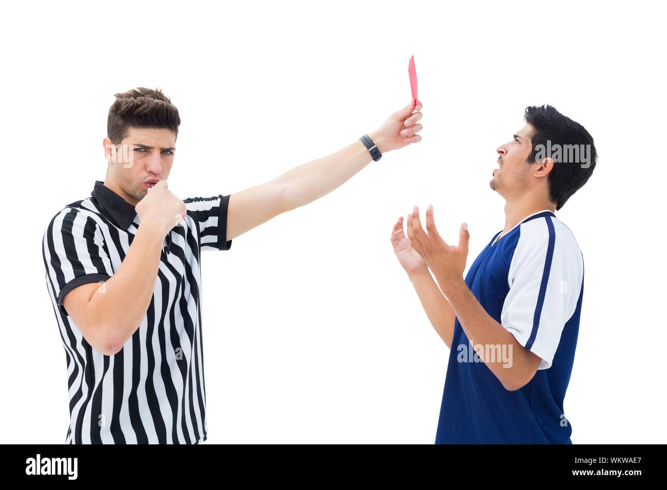 Referee sending off football player on white background Stock Photo - Alamy