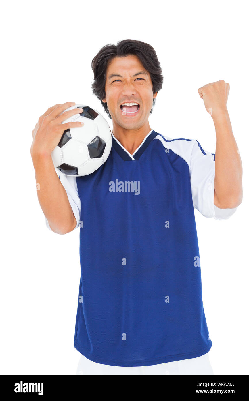 Football player in blue celebrating on white background Stock Photo - Alamy