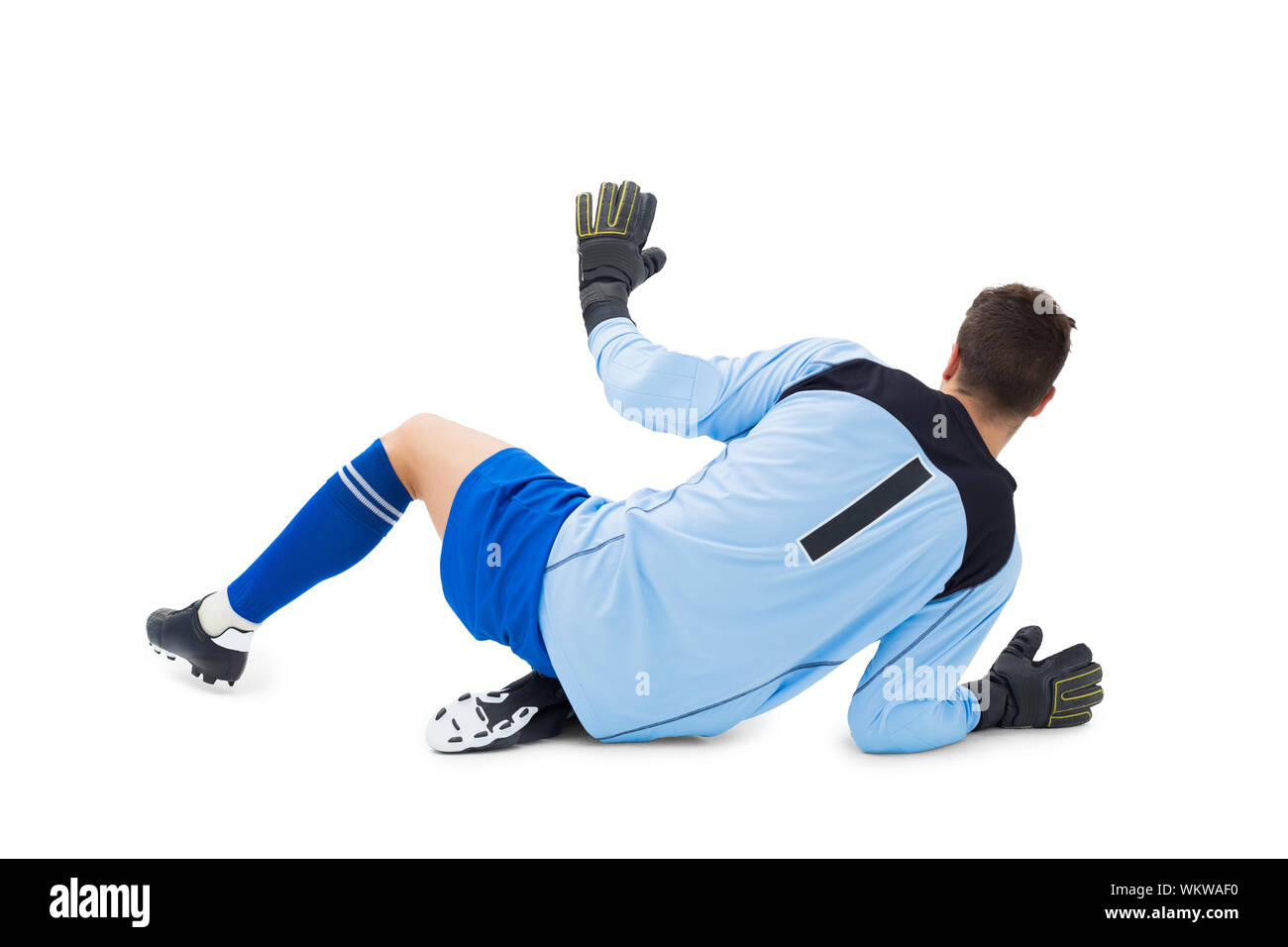 Goalkeeper in blue making a save on white background Stock Photo - Alamy