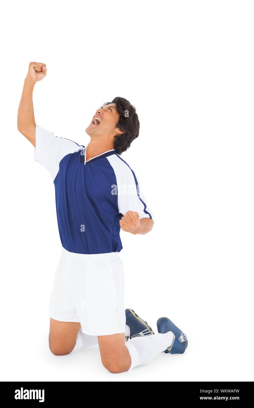 Football player in blue celebrating on white background Stock Photo - Alamy