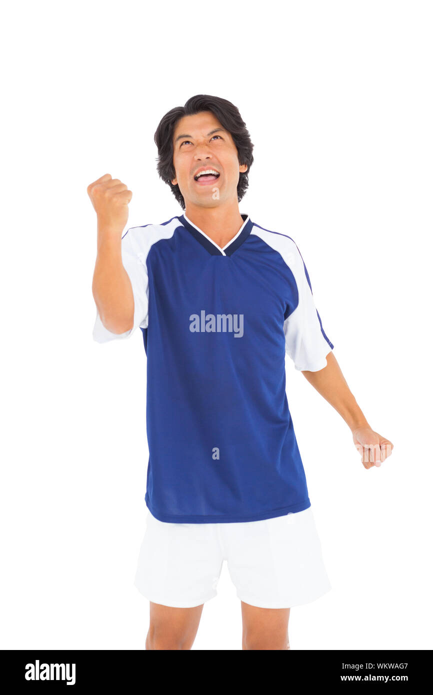 Football player in blue celebrating on white background Stock Photo - Alamy