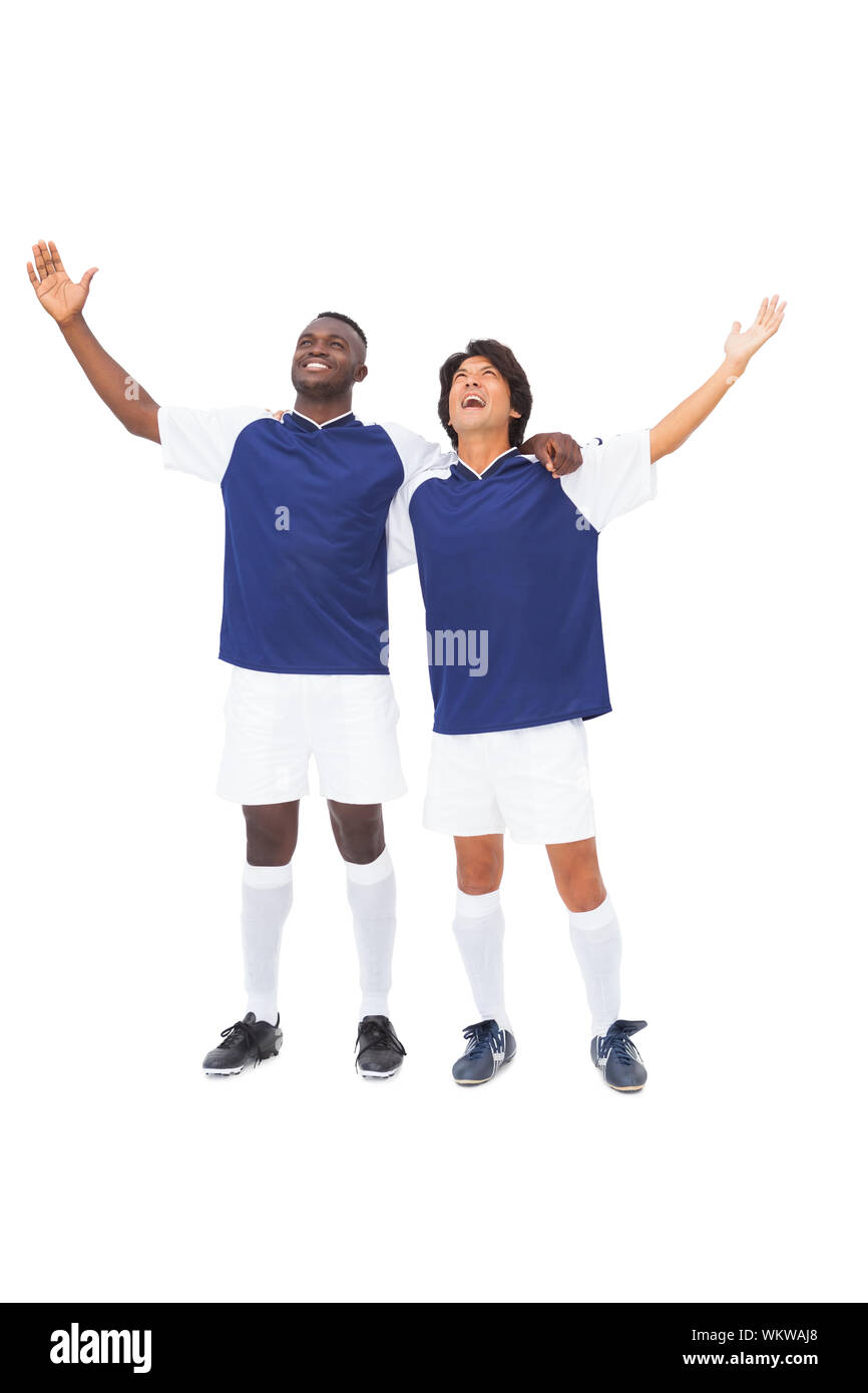 Football players in blue celebrating on white background Stock Photo ...
