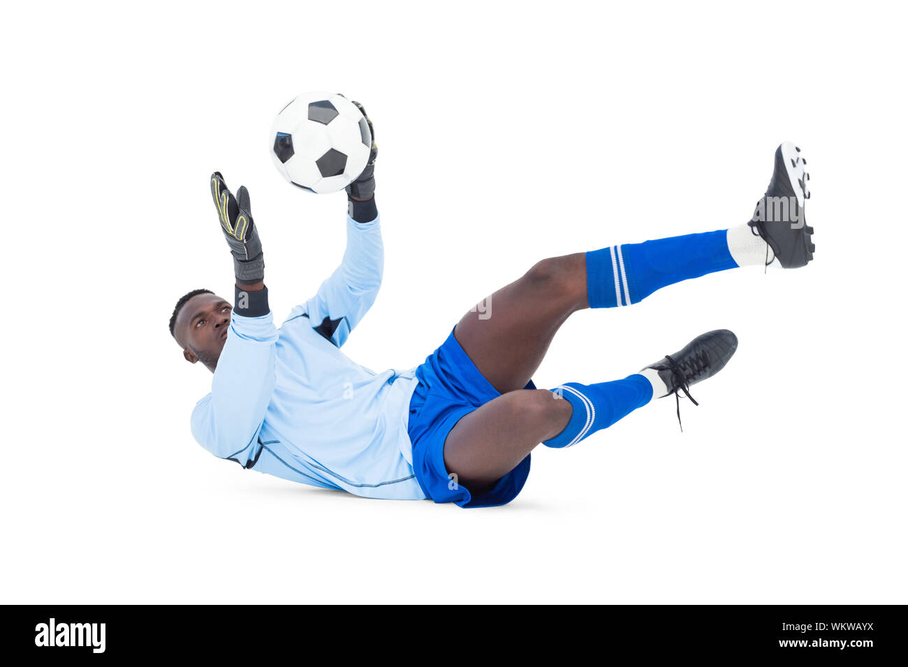 Goalkeeper in blue making a save on white background Stock Photo - Alamy